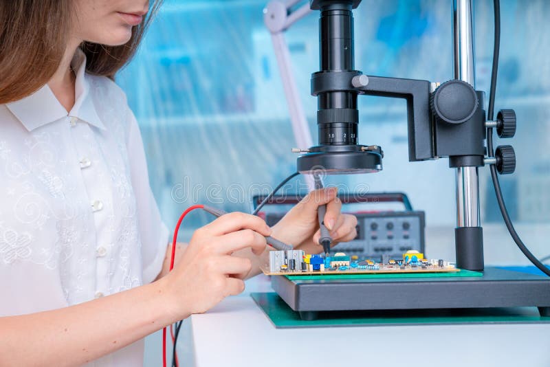 Young Woman in Inspection Electronics PCB Devise. Modern Electronics ...