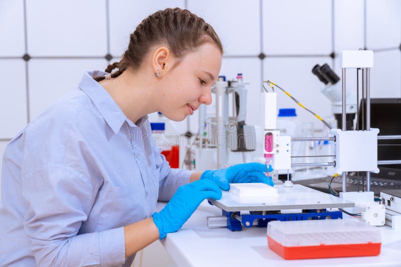 Young Woman Installs a Microplate for DNA Analysis of Biological ...