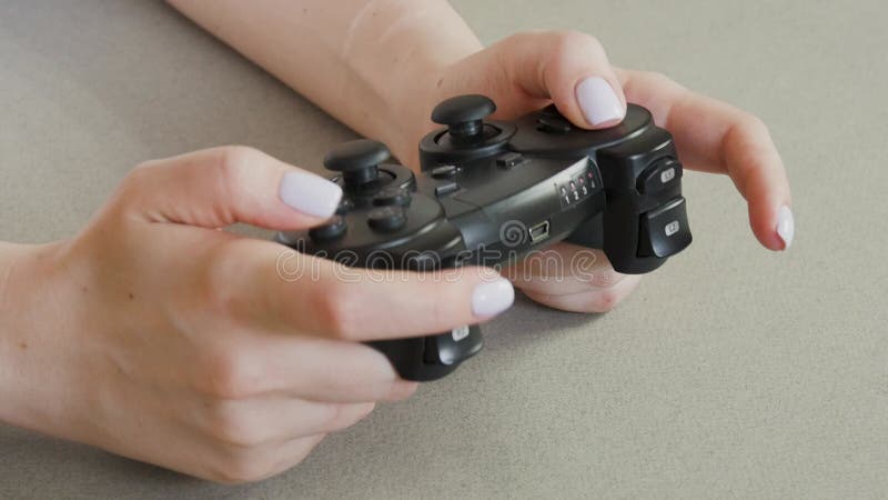 Young Woman Intensely Playing a Computer Game. Woman Hands with Gamepad ...