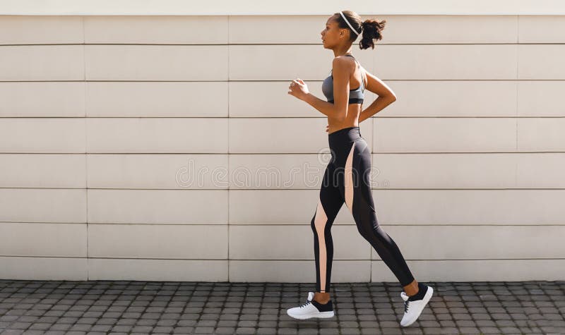 Young Woman Jogging Near a Wall Stock Image - Image of jogging ...