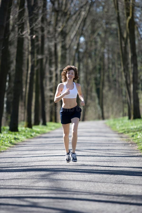 Young Woman during Jogging in a Park Stock Image - Image of digital ...