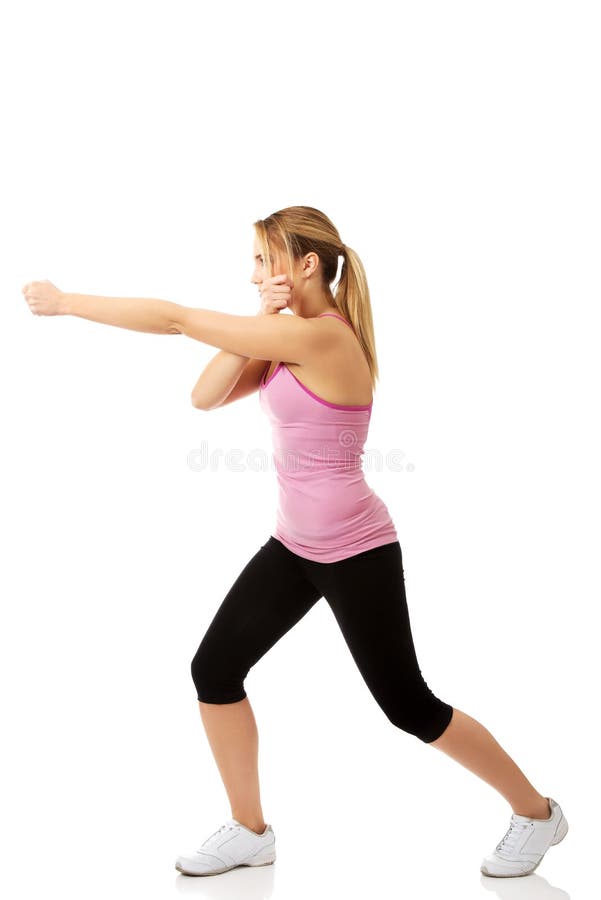 Young Woman in Kick Fitness Pose. Stock Image - Image of active ...