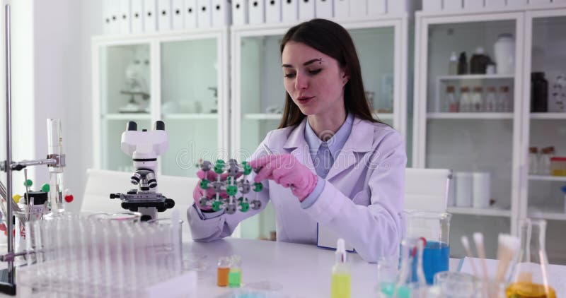 Young Woman Holds Molecular Model Explaining Structure in Lab Stock ...
