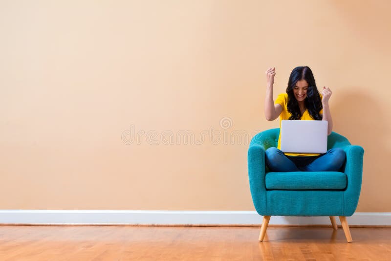 Young Woman with a Laptop Computer with Successful Pose Stock Photo ...