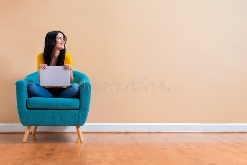 Young Woman with a Laptop Computer in a Thoughtful Pose Stock Photo ...