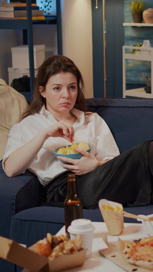 Young Woman Laying on Couch Holding Bowl of Chips Stock Image - Image ... Young Woman Laying on Couch Holding Bowl of Chips Stock Image - Image ...