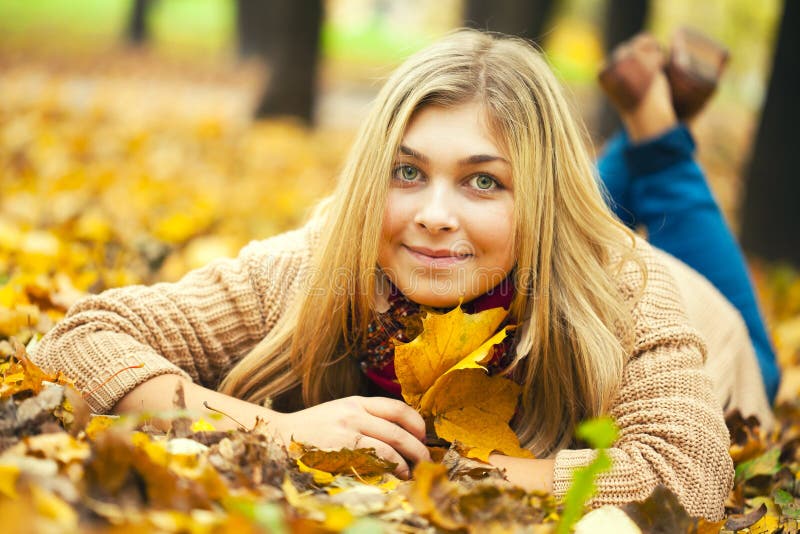 Young Woman Laying Down on the Ground Stock Image - Image of enjoying ...