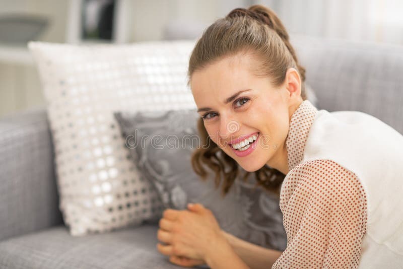 Young woman laying on sofa stock photo. Image of relax - 46682414