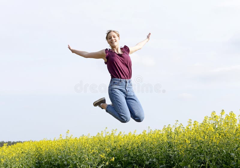 Young Woman Leaping in the Field Stock Image - Image of cheerful, girl ...