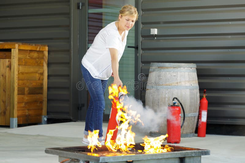 Woman Learning To Use Fire Extinguisher Stock Photos - Free & Royalty ...
