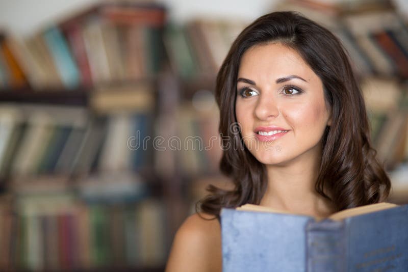 Young woman in a library stock photo. Image of happy - 101705156