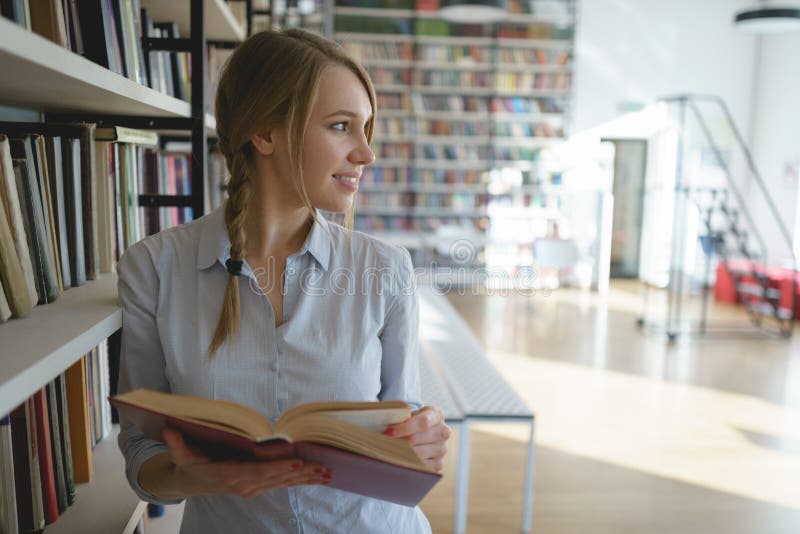Young woman in library stock photo. Image of caucasian - 78927154