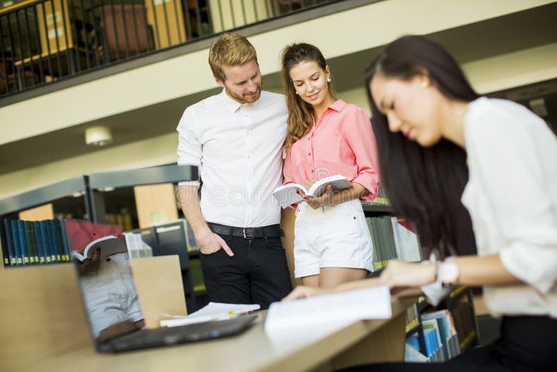 Young woman in the library stock image. Image of young - 60929991