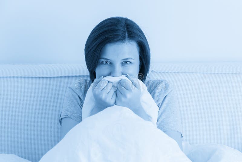 Young Woman Sitting in Bed and is Scared and Terrified Stock Photo ...