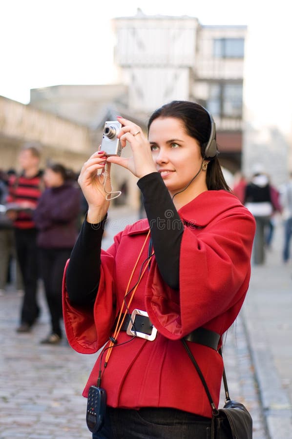 Young Woman Listening To Audio Guide Stock Photo - Image of building ...