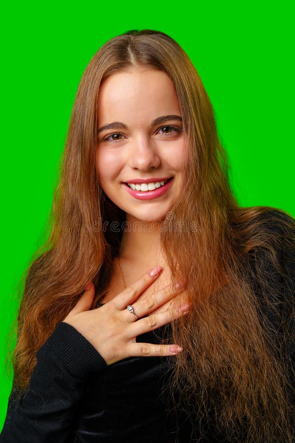 Young Woman with Long Hair Standing in Front of Green Screen Stock ...
