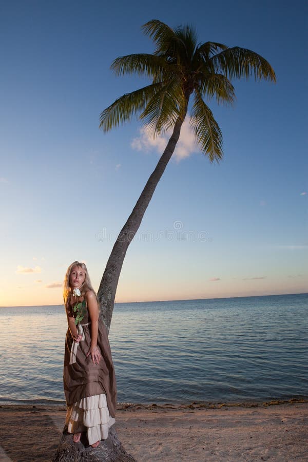 The Young Woman in a Long Sundress on a Tropical Beach. Polynesia ...