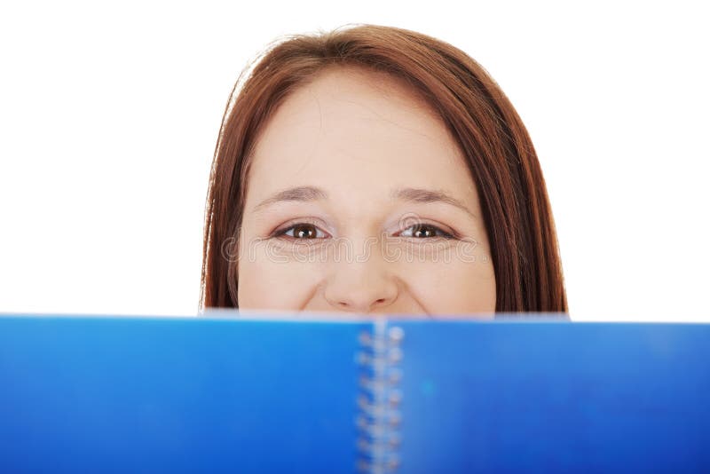 Young Woman is Looking Above Open Note Book. Stock Photo - Image of ...
