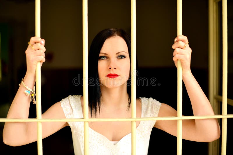 Young Woman Looking from Behind the Bars Stock Photo - Image of culture ...