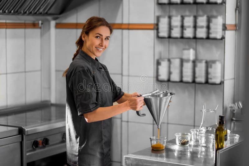 Young Woman Looking Busy while Cooking in the Kitchen Stock Image ...