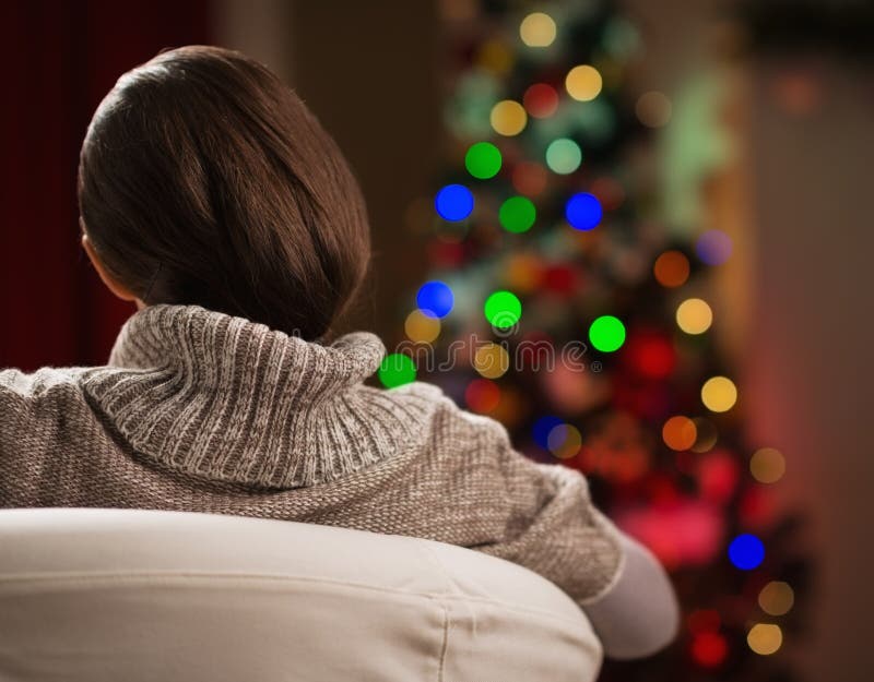 Young Woman Looking on Christmas Tree. Rear View Stock Photo - Image of ...