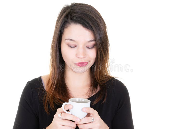 Young Woman Looking Down Coffee Cup in Hand Stock Image - Image of ...