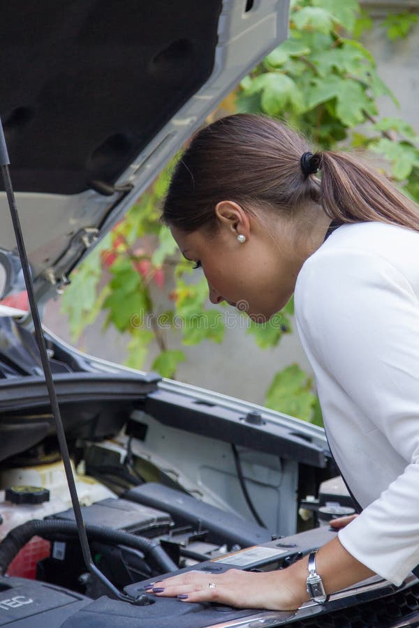 Young Woman Looking Down the Engine of a Car Stock Image - Image of ...