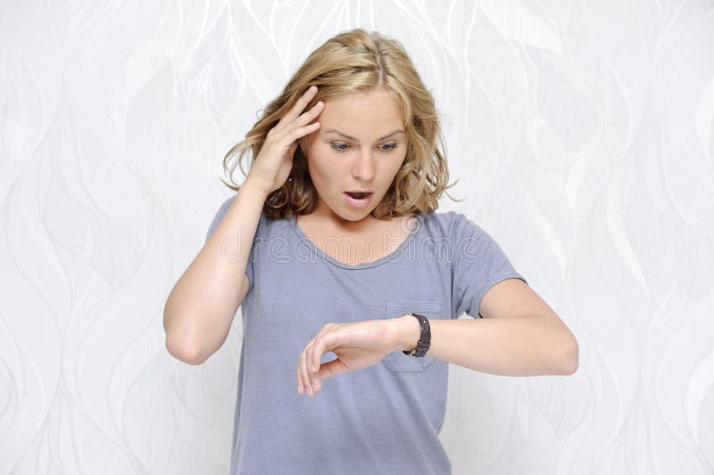 Young Woman Looking at Her Watch Being Late Stock Photo - Image of ...