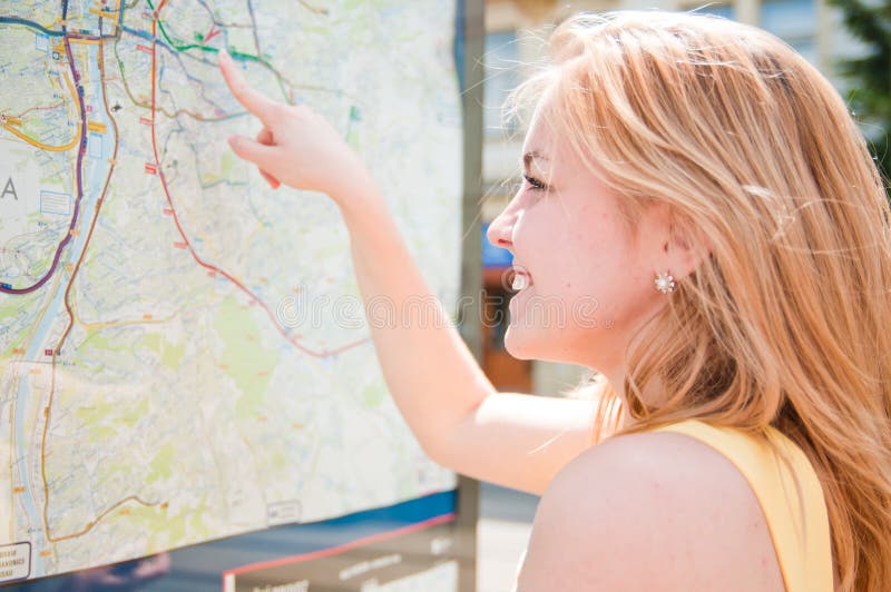 Young Woman is Looking on a Map Stock Image - Image of lost, atlas ...