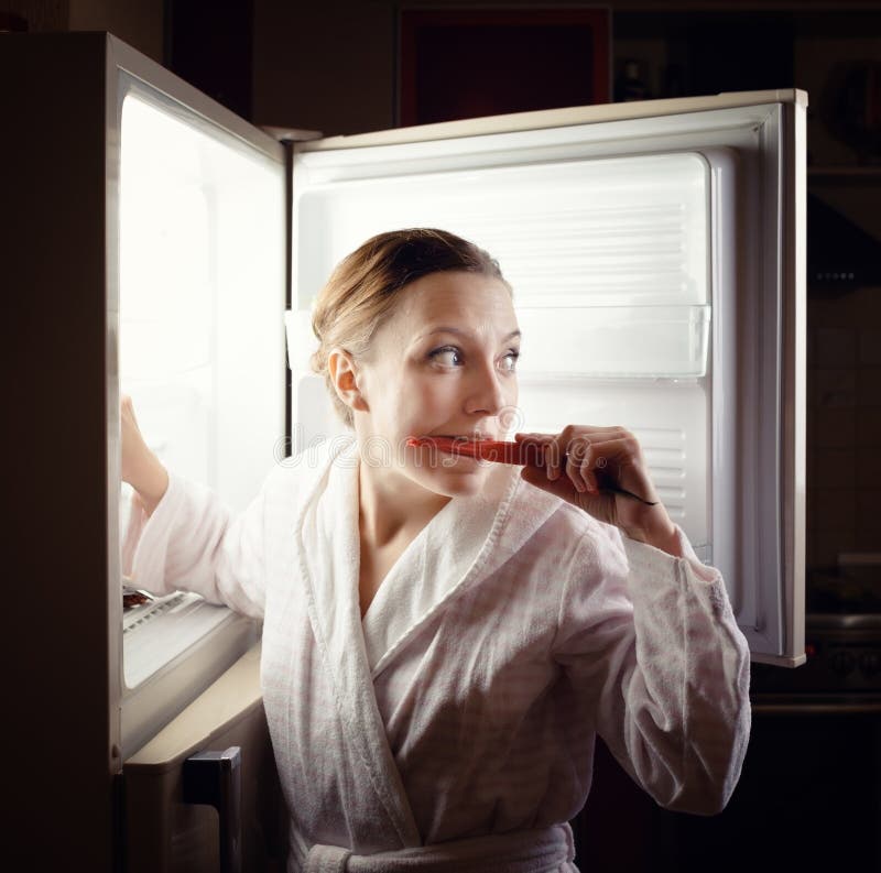 Young Woman Looking for Some Snack in Fridge Late at Night Stock Photo ...