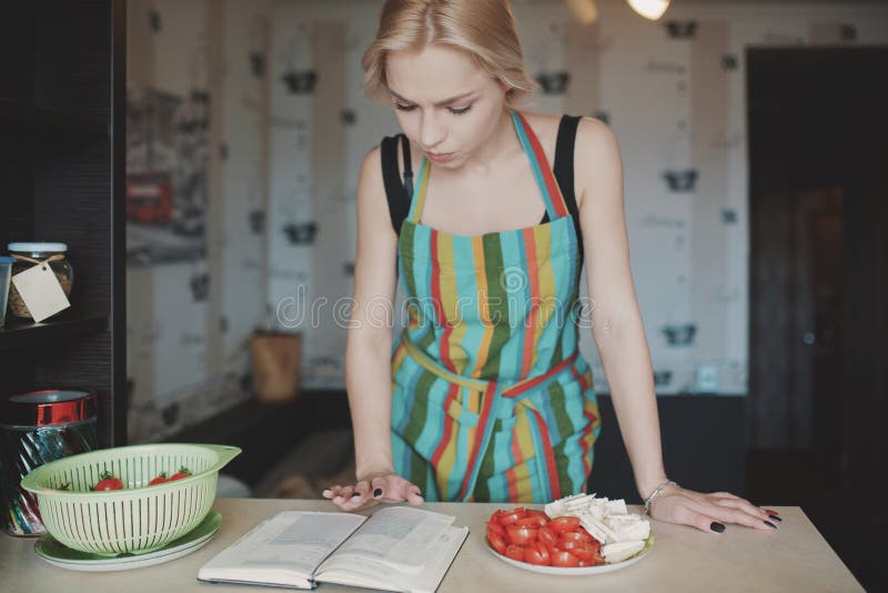 Young Woman Looking Up in a Recipes Book Stock Image - Image of organic ...