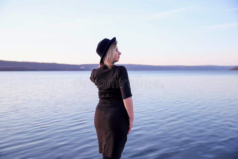 A Young Woman Looks into the Distance Stock Photo - Image of waiting ...