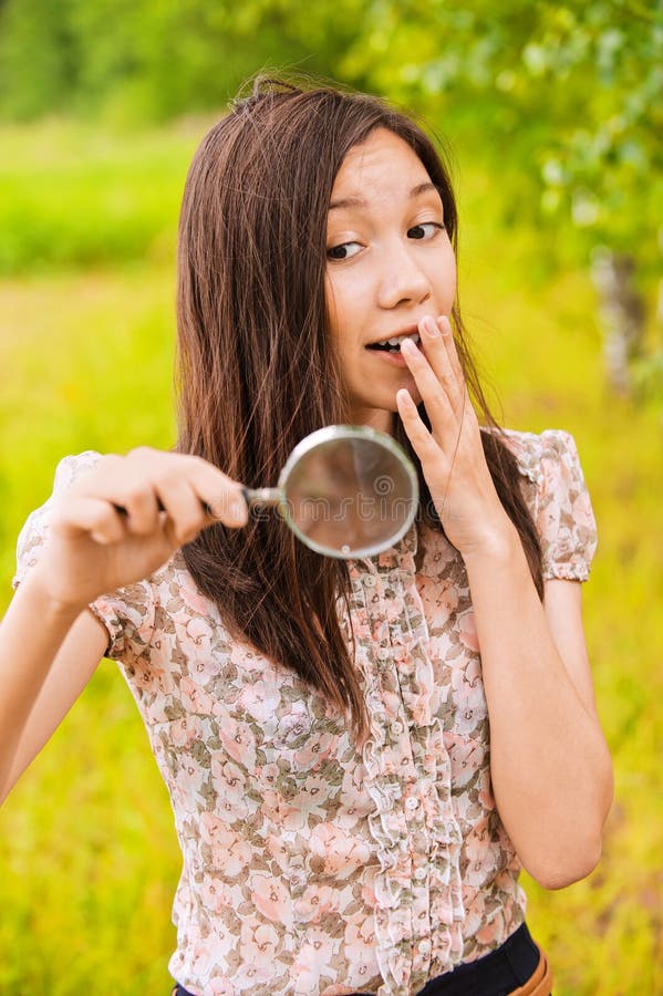 Young woman with a loupe stock image. Image of marvel - 20245677