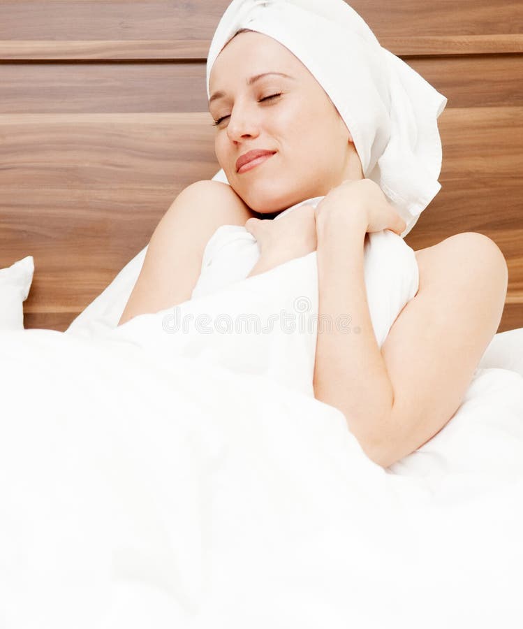 Young Woman Luxuriating in Soft Bed Stock Image - Image of face, model ...