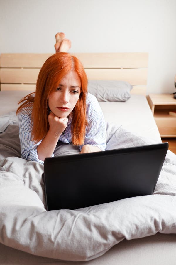 Young Woman Lying on Bed with Laptop Computer Stock Photo - Image of ...