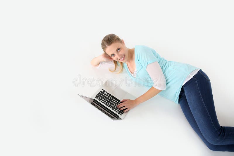 Young Woman Lying on Floor Using Laptop Stock Image - Image of ...