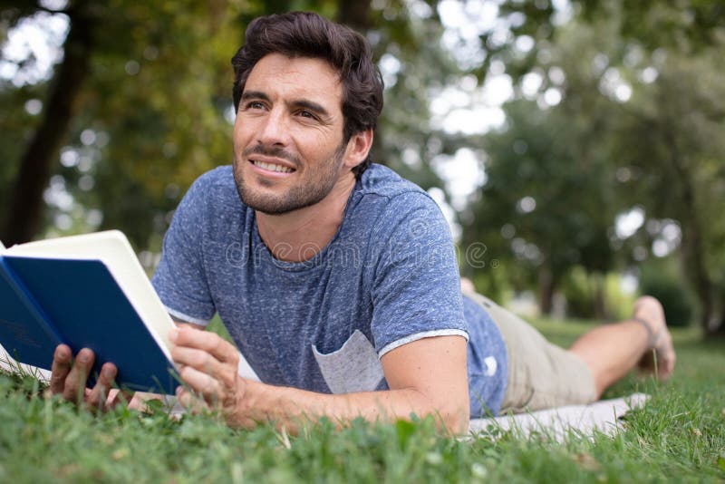 Young Woman Lying and Reading Favorite Book Stock Photo - Image of cute ...