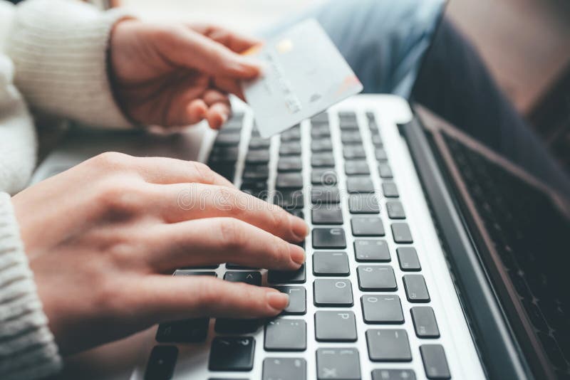 A Young Woman Makes an Online Payment for a Purchase. Stock Image ... A Young Woman Makes an Online Payment for a Purchase. Stock Image ...