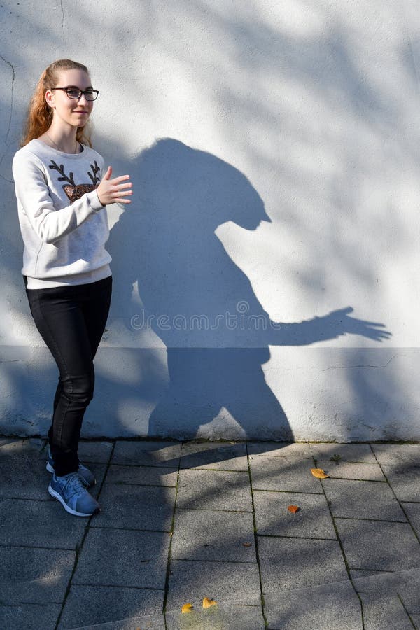 Shadow of a Woman on White Wall Stock Image - Image of hand, shadow ...