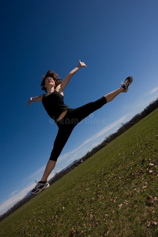 Young woman making a jump stock photo. Image of caucasian - 4592326