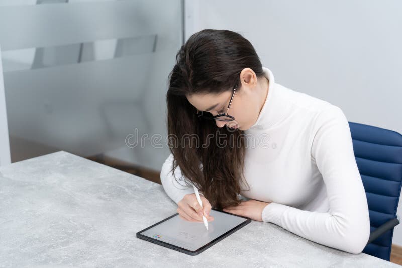 Young Profesional Making Notes on the Electronic Tablet Stock Image ...