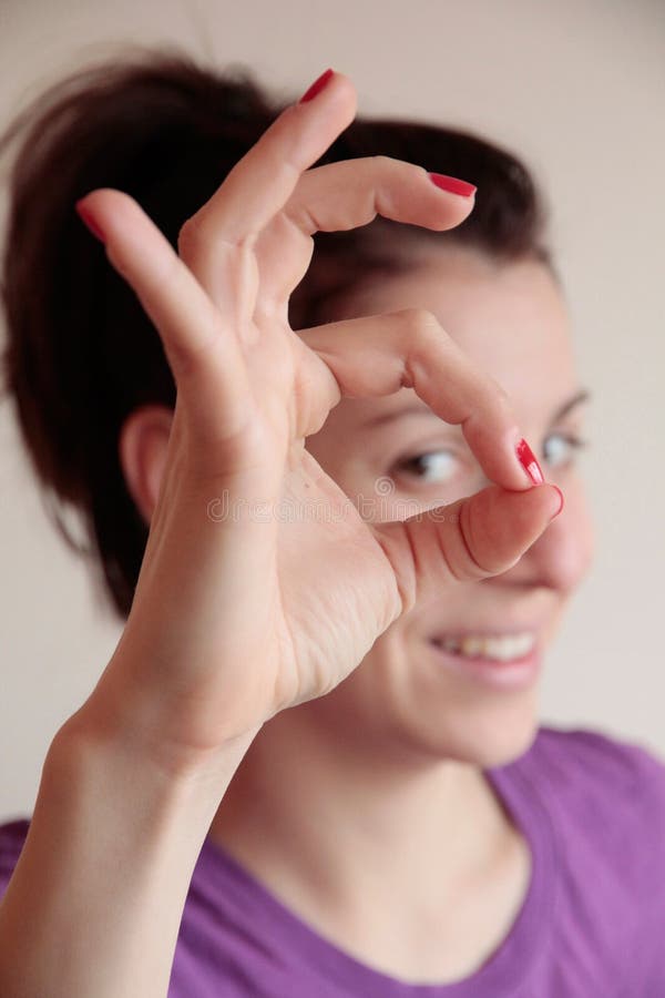 Young woman making OK sign stock image. Image of perfect - 75516141