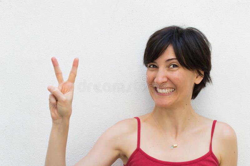Young Woman Making a Peace Sign Stock Photo - Image of female, clean ...