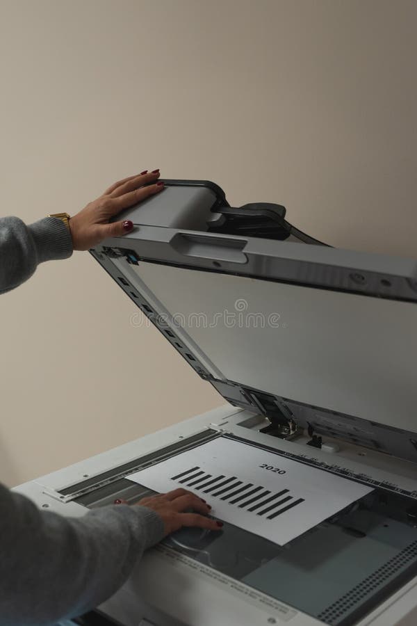 Young Woman Making Photocopies of a Chart Stock Photo - Image of busy ...
