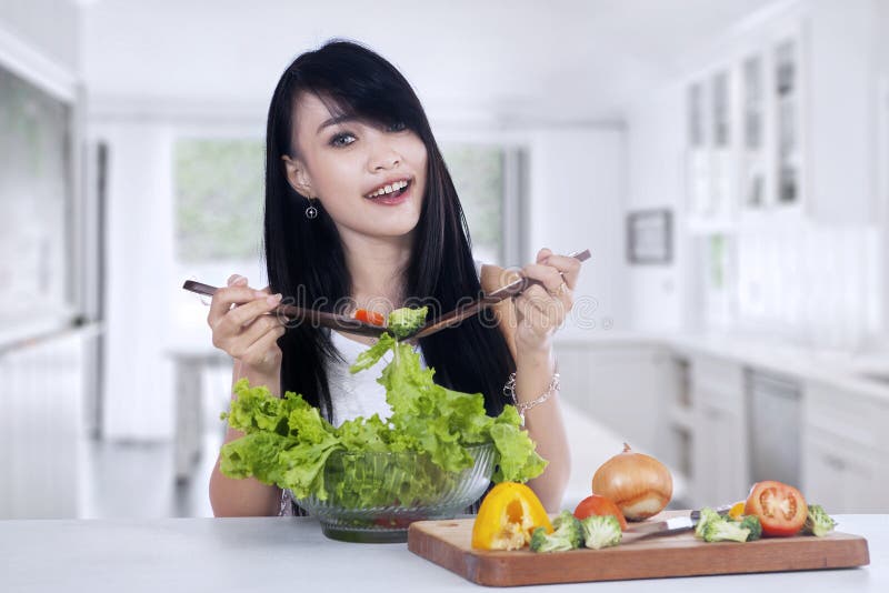 Young woman making salad stock image. Image of bowl, kitchen - 37428731