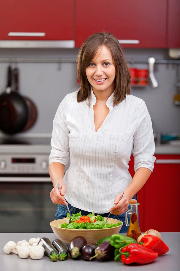 Young woman making salad stock image. Image of human - 49296865