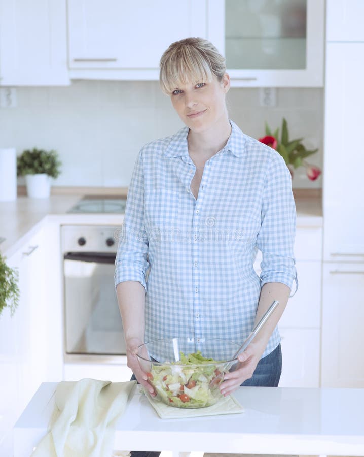 Young woman making salad stock photo. Image of everyday - 85307468