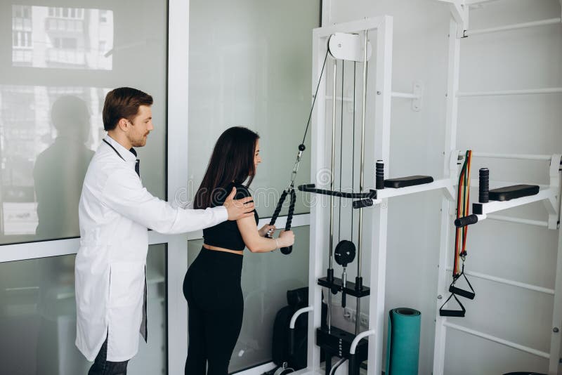 Young Woman Making Spine Examination in Diagnostics Machine with ...