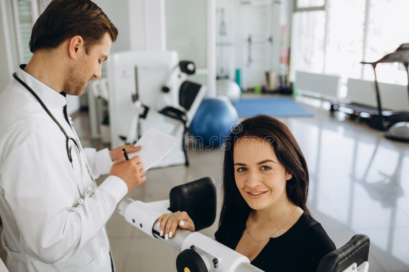 Young Woman Making Spine Examination in Diagnostics Machine with ...
