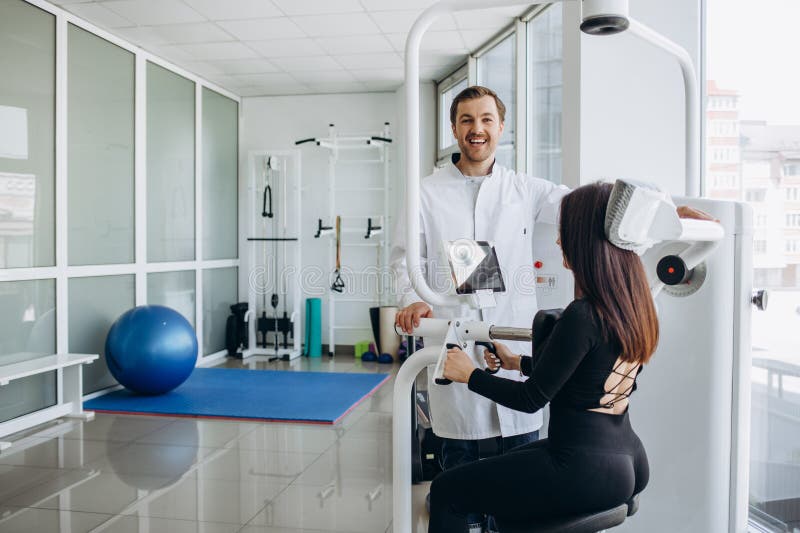 Young Woman Making Spine Examination in Diagnostics Machine with ...